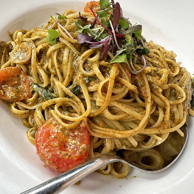This pasta isn't just twirled on a plate; it's a symphony of textures where al dente linguine dances with fresh tomatoes and microgreens in perfect harmony. 