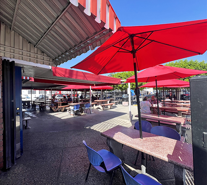 The outdoor patio where red umbrellas provide shade while you dive into seafood heaven. Los Angeles sunshine and fresh fish &ndash; a perfect California pairing.