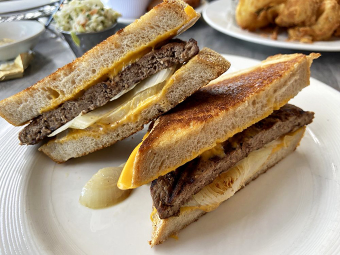 The humble patty melt gets the Stage Deli treatment &ndash; grilled to perfection with melty cheese that stretches with each bite.