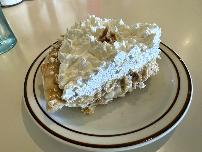 This isn't just pie&mdash;it's a cloud of whipped cream floating atop layers of peanut butter decadence that would make Elvis swivel his hips in approval.