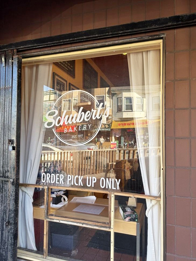 Order pickup window where dreams come packaged in boxes, ready for your next sweet adventure.