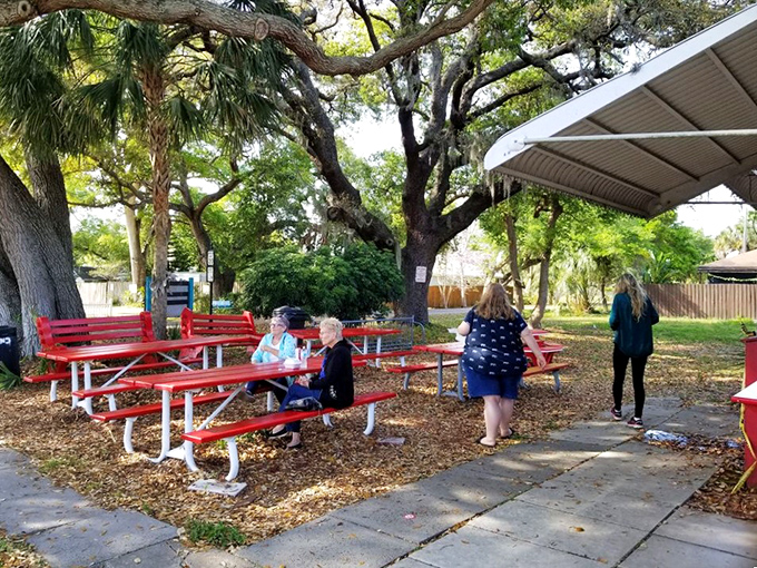 Picnic tables under ancient oaks&mdash;nature's dining room where strangers become friends, united by the universal language of great barbecue.