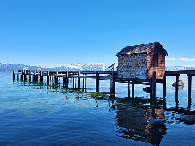 This humble boathouse on stilts has better waterfront real estate than most millionaires. Snow-capped mountains included at no extra charge.