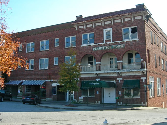 The Plantation House building stands as a testament to early 20th-century commercial architecture, now housing modern businesses in historic wrapping.