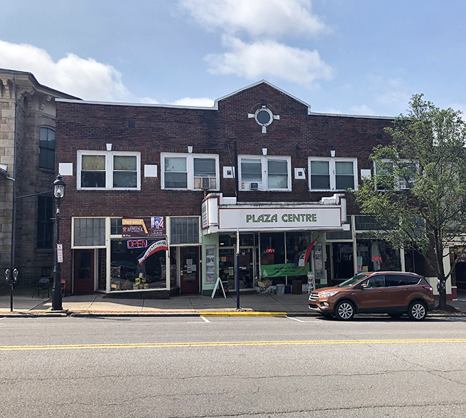 Plaza Centre anchors downtown with the confidence of a building that's seen trends come and go while maintaining its dignified brick presence.