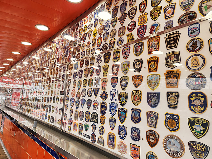A wall of police patches tells stories of visitors from across the nation. Even law enforcement can't resist the call.
