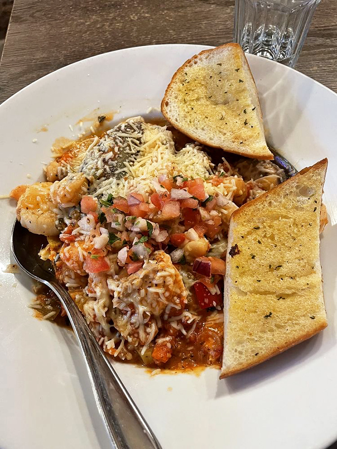 Pasta that doesn't just sit on the plate&mdash;it demands attention. Those garlic toasts aren't mere sides; they're essential sauce-sopping tools.
