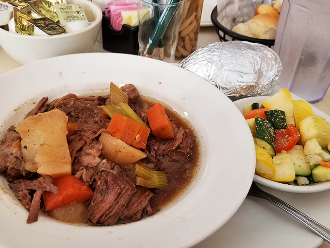 This pot roast doesn't just fall apart&mdash;it surrenders completely, surrounded by vegetables that have soaked up all that savory goodness.