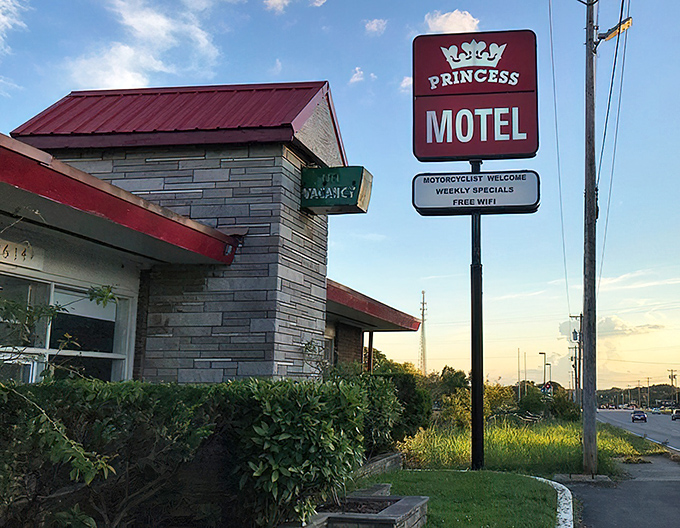 The Princess Motel sign stands as a neon-lit reminder of road trips before GPS, when vacancy signs were beacons of relief after hours behind the wheel.
