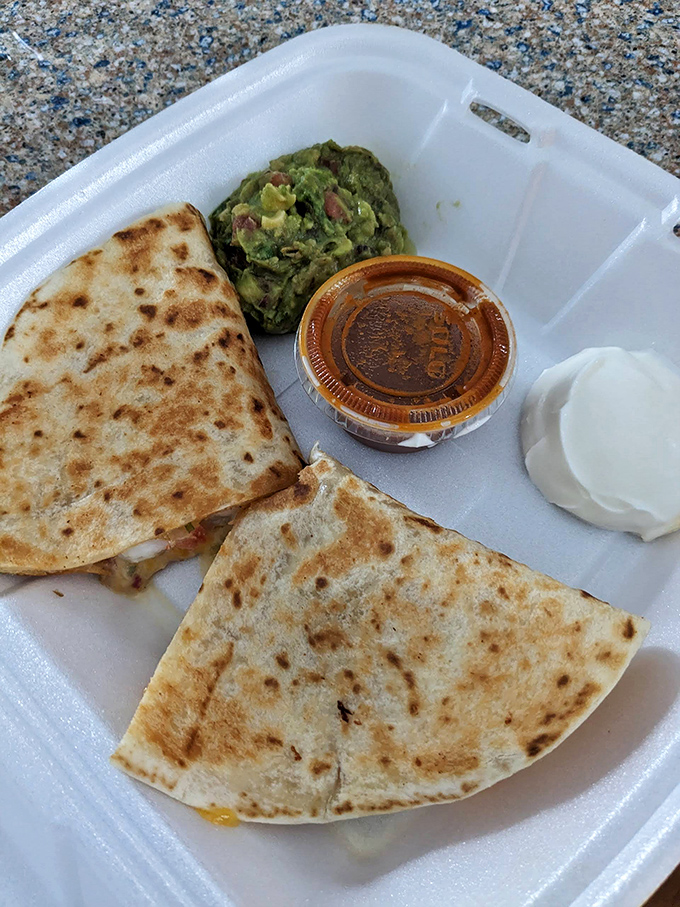 This quesadilla brings serious cheese pull potential, with guacamole and salsa standing by to elevate each bite to new heights.