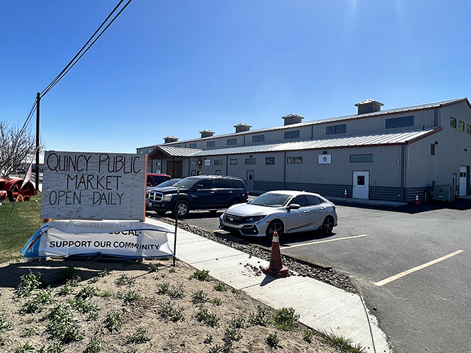 The Quincy Public Market sign promises fresh local produce without the "artisanal" markup. Farm-to-table eating that respects your retirement budget.