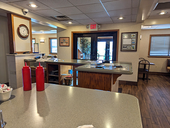 The heart of operations—where orders are called, coffee is poured, and children's artwork serves as the most authentic decor.