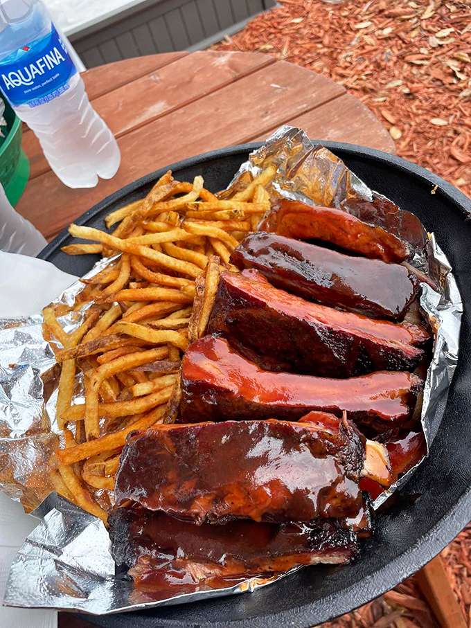 These ribs aren't just glazed&mdash;they're lacquered with a sauce so shiny you could check your reflection before diving face-first into barbecue bliss. 