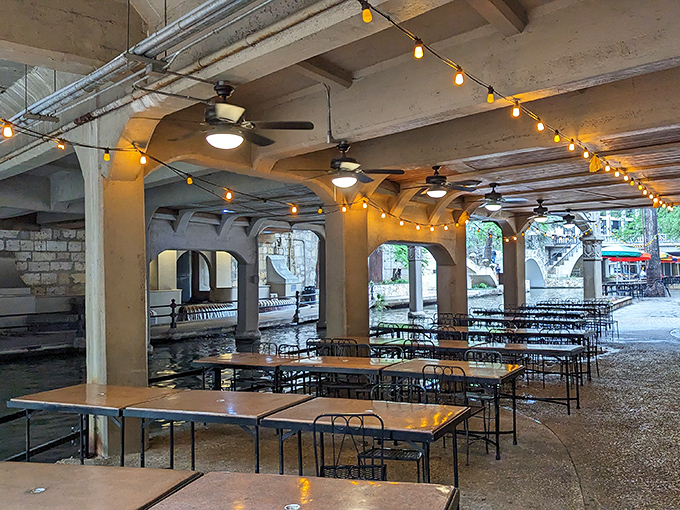String lights create a magical canopy over riverside tables – romance isn't included on the menu but somehow arrives with every meal.