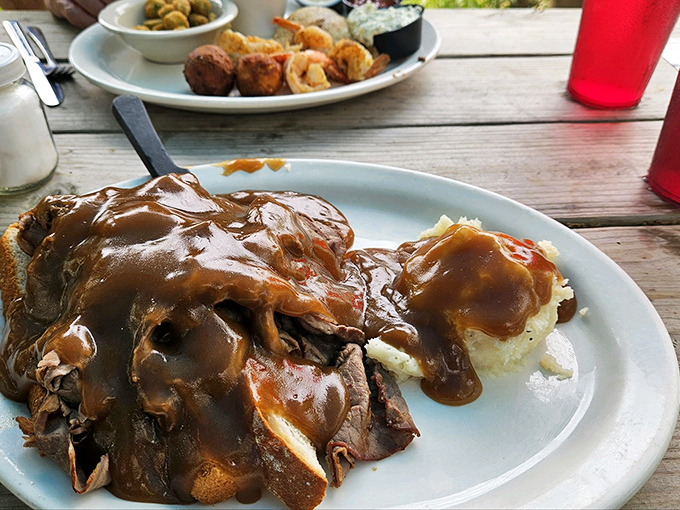 A roast beef sandwich that could make a vegetarian reconsider, piled high like a meaty skyscraper of joy.