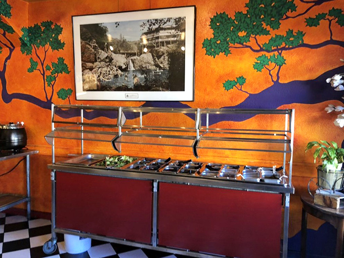 The salad bar's vibrant colors pop against the orange mural backdrop&mdash;proof that even a historic saloon understands the importance of fresh options.