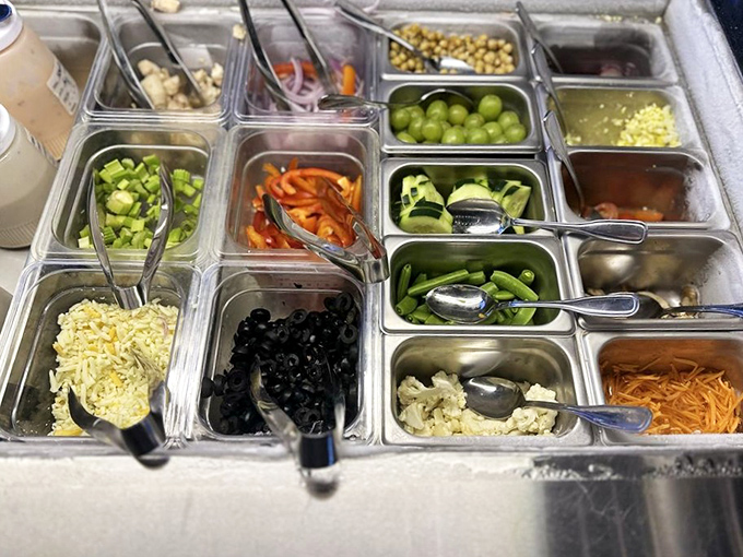 The salad bar's secret weapon: fresh ingredients prepped daily, proving that sometimes the supporting characters deserve just as much applause as the stars.