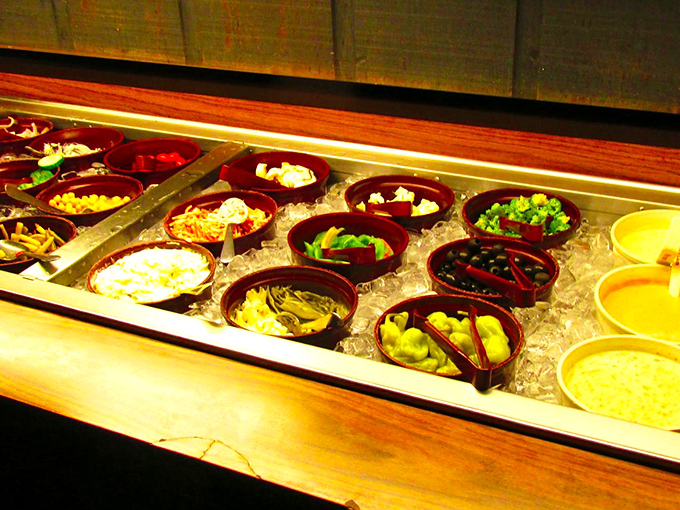 A salad bar that takes its job seriously, offering fresh reinforcements for your dining adventure.