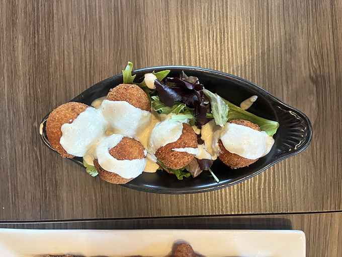 These golden-fried sauerkraut balls with creamy dipping sauce are Ohio's answer to arancini&mdash;crispy outside, tangy inside, and completely addictive all around.
