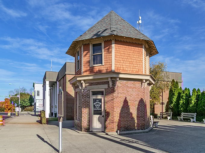 This charming brick octagonal building stands like a Victorian sentry box, proving that even utility structures were once built with whimsy and character.
