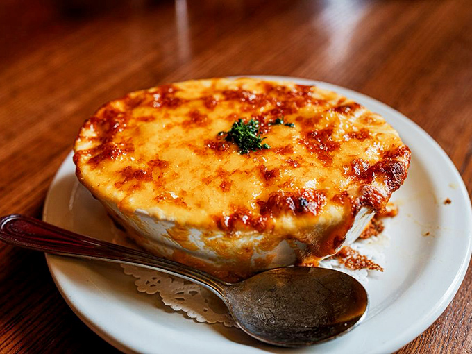 Mac and cheese elevated to art form&mdash;that golden, bubbling crust hiding creamy depths beneath. Comfort food that's had a serious upgrade.
