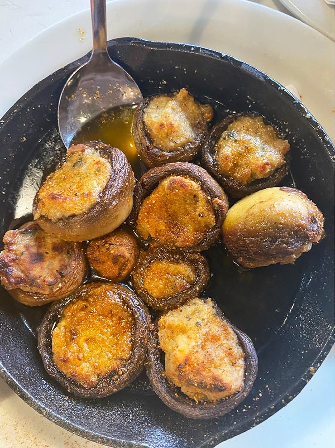 Mushrooms stuffed with seafood—nature's little cups filled with treasures from the sea.