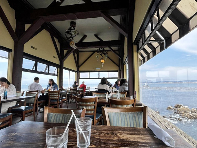 Tables positioned for maximum drama, where every seat offers front-row tickets to nature's greatest show: the ever-changing moods of Monterey Bay.