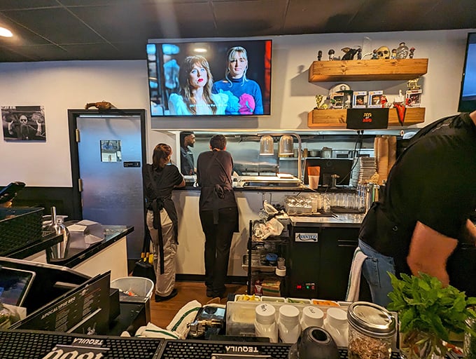 The service counter buzzes with activity as staff efficiently deliver smoky perfection to eager diners throughout the day.