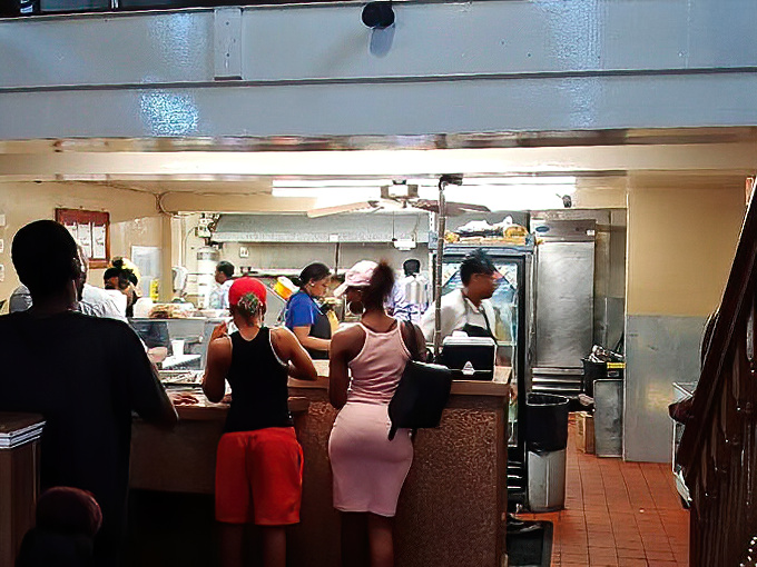 The lunch counter scene—a daily ritual where regulars and first-timers alike line up for their chance at soul food nirvana.