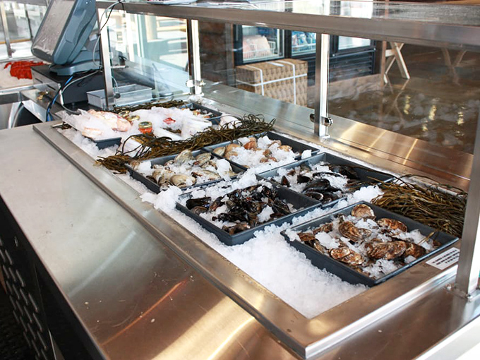 The seafood display case&mdash;where dreams begin and decisions get difficult. Each tray holds potential happiness on ice, waiting for its moment.
