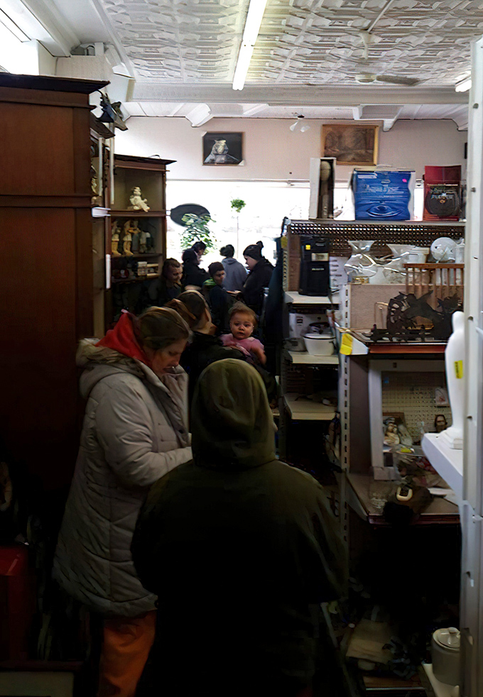 Fellow treasure hunters browse with the focused intensity of archaeologists discovering ancient artifacts in modern aisles.
