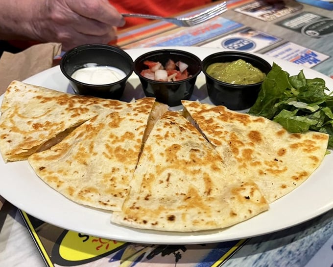 These quesadillas aren't just grilled—they're transformed into golden-brown envelopes delivering urgent messages of deliciousness directly to your taste buds.