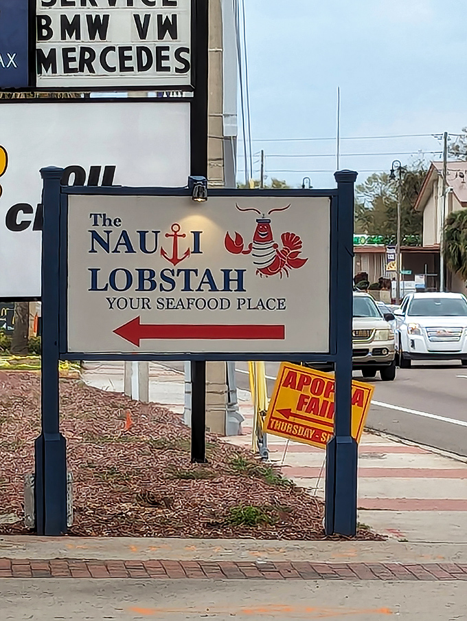 Follow the red arrow to happiness. This sign doesn't just give directions&mdash;it offers a promise of seafood salvation.