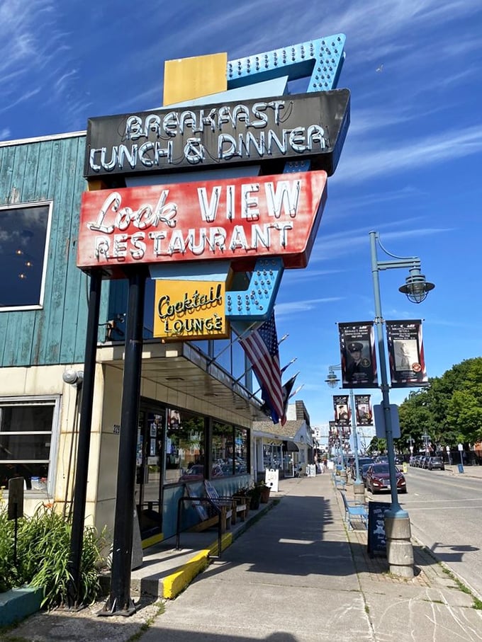The vintage sign beckons like a neon lighthouse, guiding hungry travelers to a port of culinary comfort.