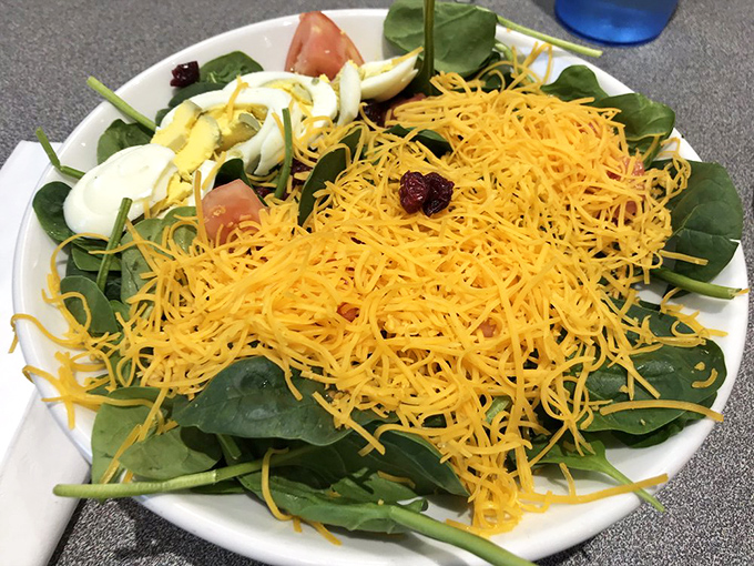 Even the salads get the Cincinnati treatment&mdash;fresh spinach playing host to that famous shredded cheddar crown.