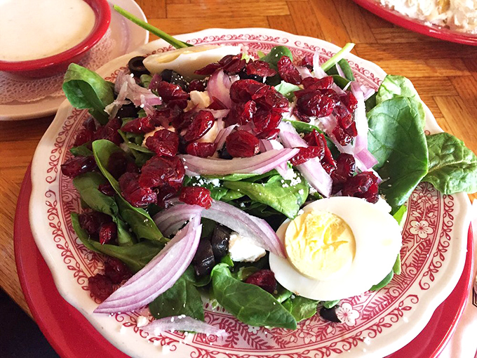 Even the salads at Heidi's mean business – spinach, cranberries, red onion, and a perfectly boiled egg create a refreshing counterpoint to breakfast indulgence.