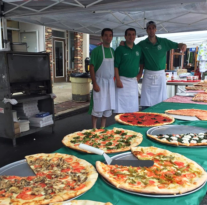 The green team ready to serve up happiness &ndash; these guys know their way around a pizza paddle.