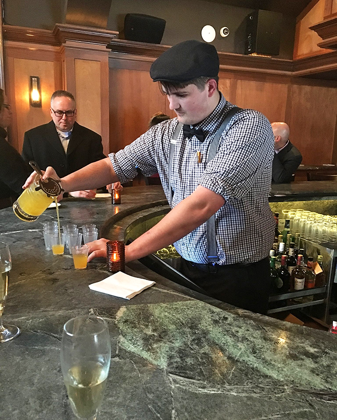 Skilled bartenders craft liquid artistry with the same passion and precision found in every kitchen creation.
