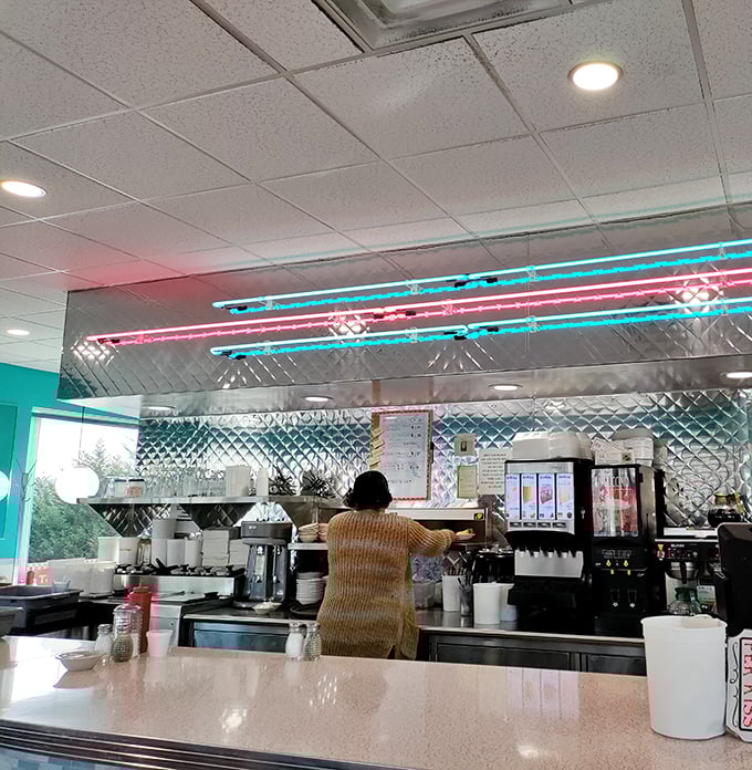 Where breakfast magic happens. The gleaming stainless steel kitchen with its neon accents is command central for Pennsylvania's home fry headquarters.