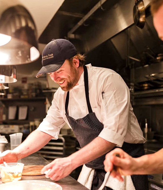The smile says it all&mdash;cooking with joy translates directly to the plate. Happy chefs make happy food.