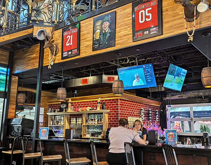 Sports memorabilia watches over patrons like friendly guardians of good times. The multi-level space invites exploration between courses and conversations.