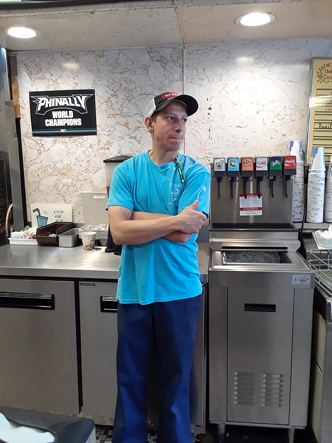 The staff at Lou's keeps the sandwich assembly line moving with practiced precision. True professionals make it look effortless.