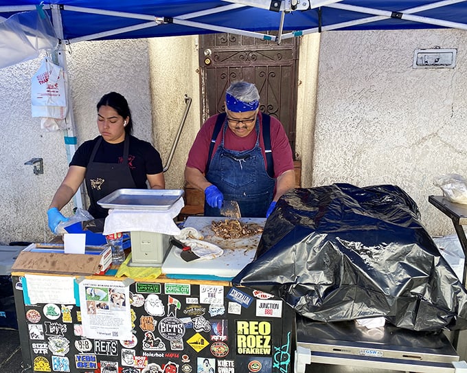 The masters at work, crafting carnitas with the precision of surgeons and the soul of poets. Watching experts practice their craft never gets old.