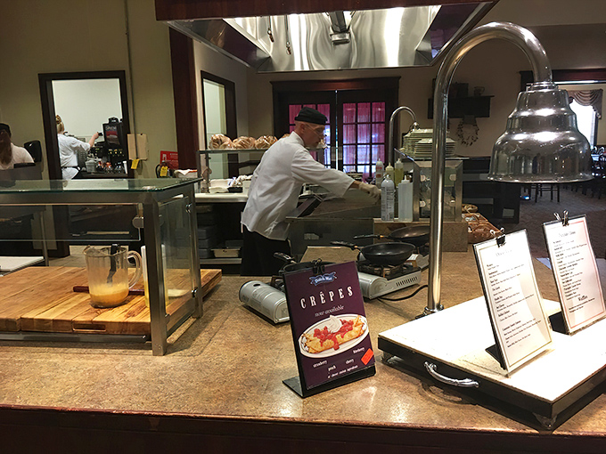 Behind every great meal is a dedicated team&mdash;this chef focuses intently on preparing crepes that will soon make someone's day a little brighter.