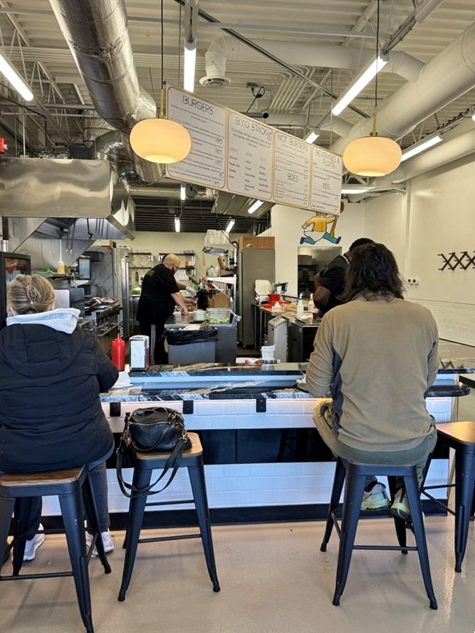 The open kitchen concept isn't just trendy—it's a statement of confidence. "Watch us work. We've got nothing to hide."