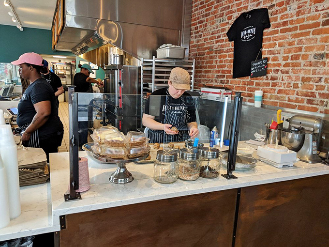 The kitchen crew works with the precision of surgeons and the passion of artists. This is where chicken dreams come true.