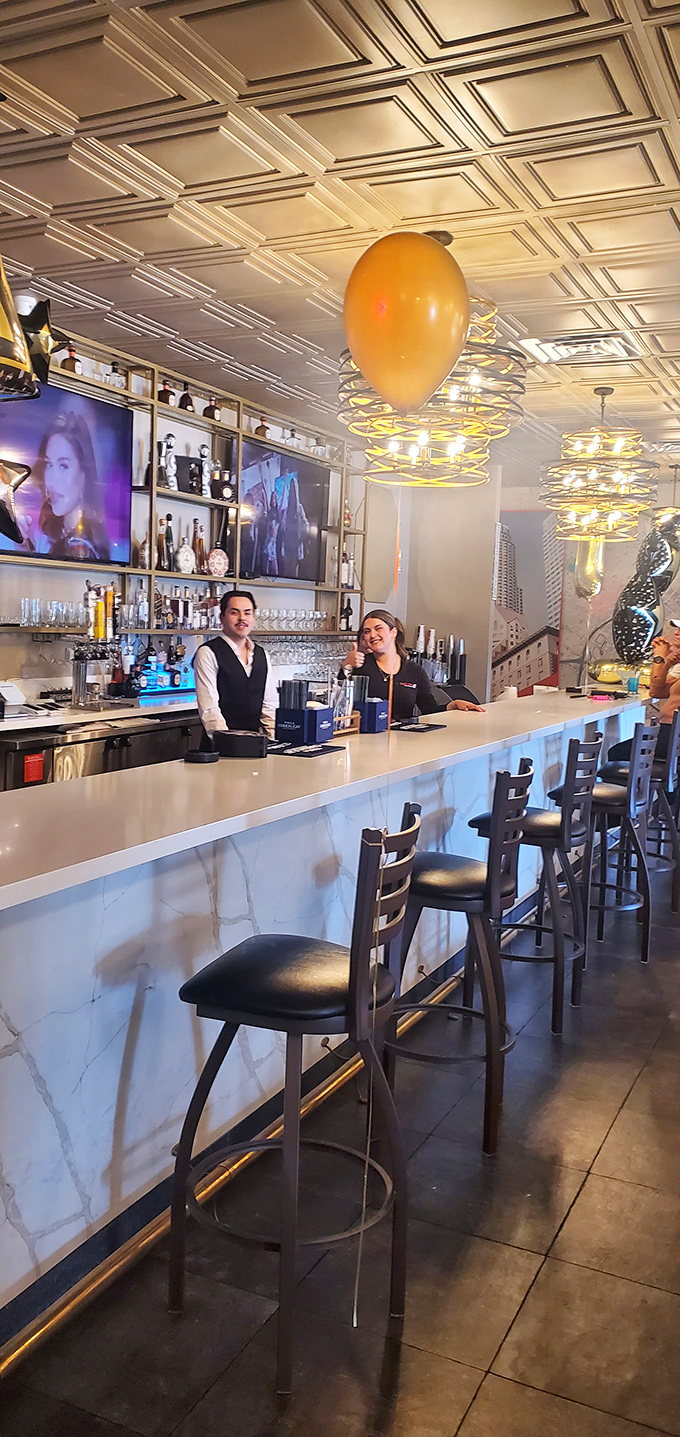 The bar staff stands ready to craft the perfect accompaniment to your seafood feast—their smiles suggesting they know exactly how good your meal will be.