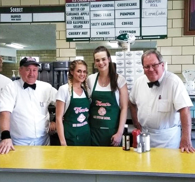 The team behind the counter wears their bow ties with pride. These aren't just servers&mdash;they're ambassadors of frozen happiness.