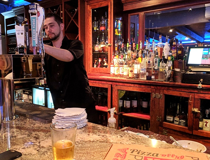 The maestro at work, orchestrating your dinner with the precision of a conductor leading the Philadelphia Orchestra.