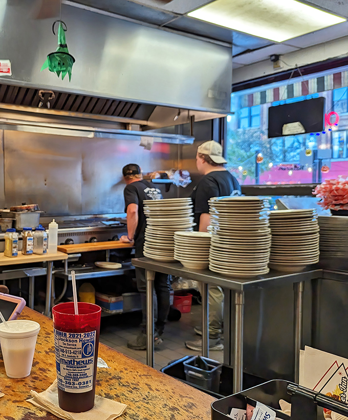 Stacks of plates waiting for their moment in the spotlight. The kitchen choreography here is a beautiful dance that's been perfected over decades.